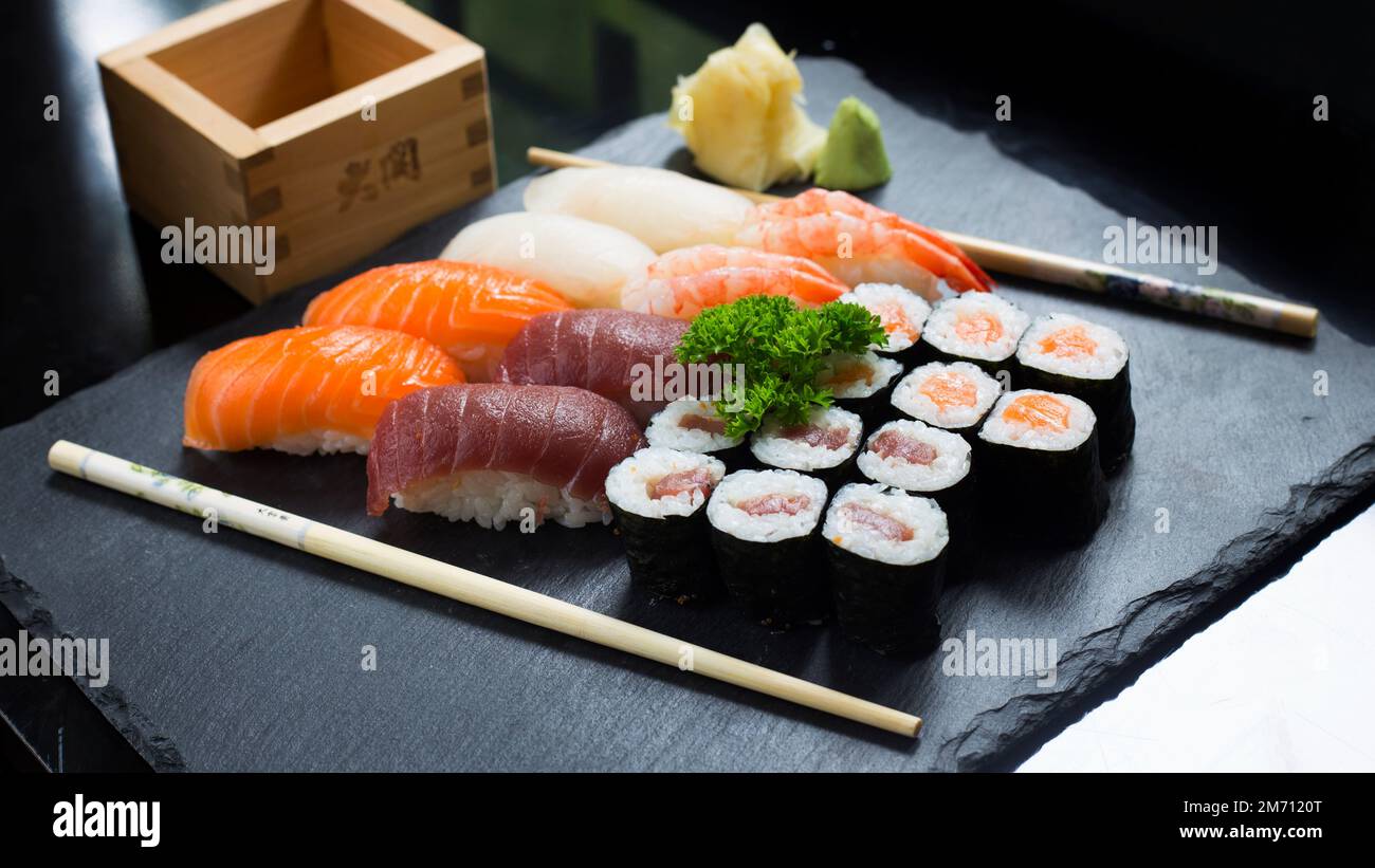 Set of sushi with variety of makis, nigiris and sashimi with fine fish ...