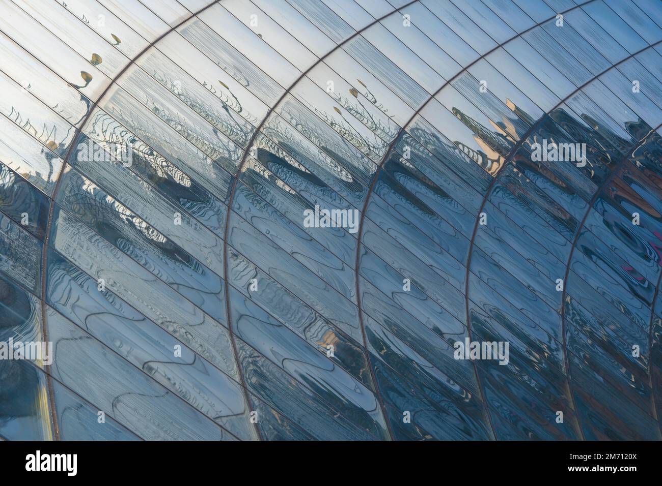 Modern office building facade. Tall business center with a glass facade ...