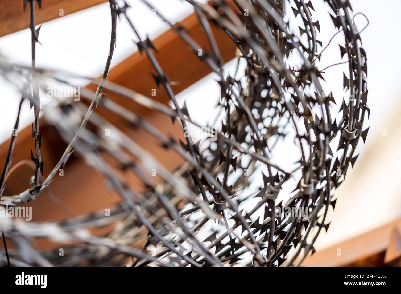 Barbed wire stretched over anti-tank hedgehogs. Fortified defense line ...