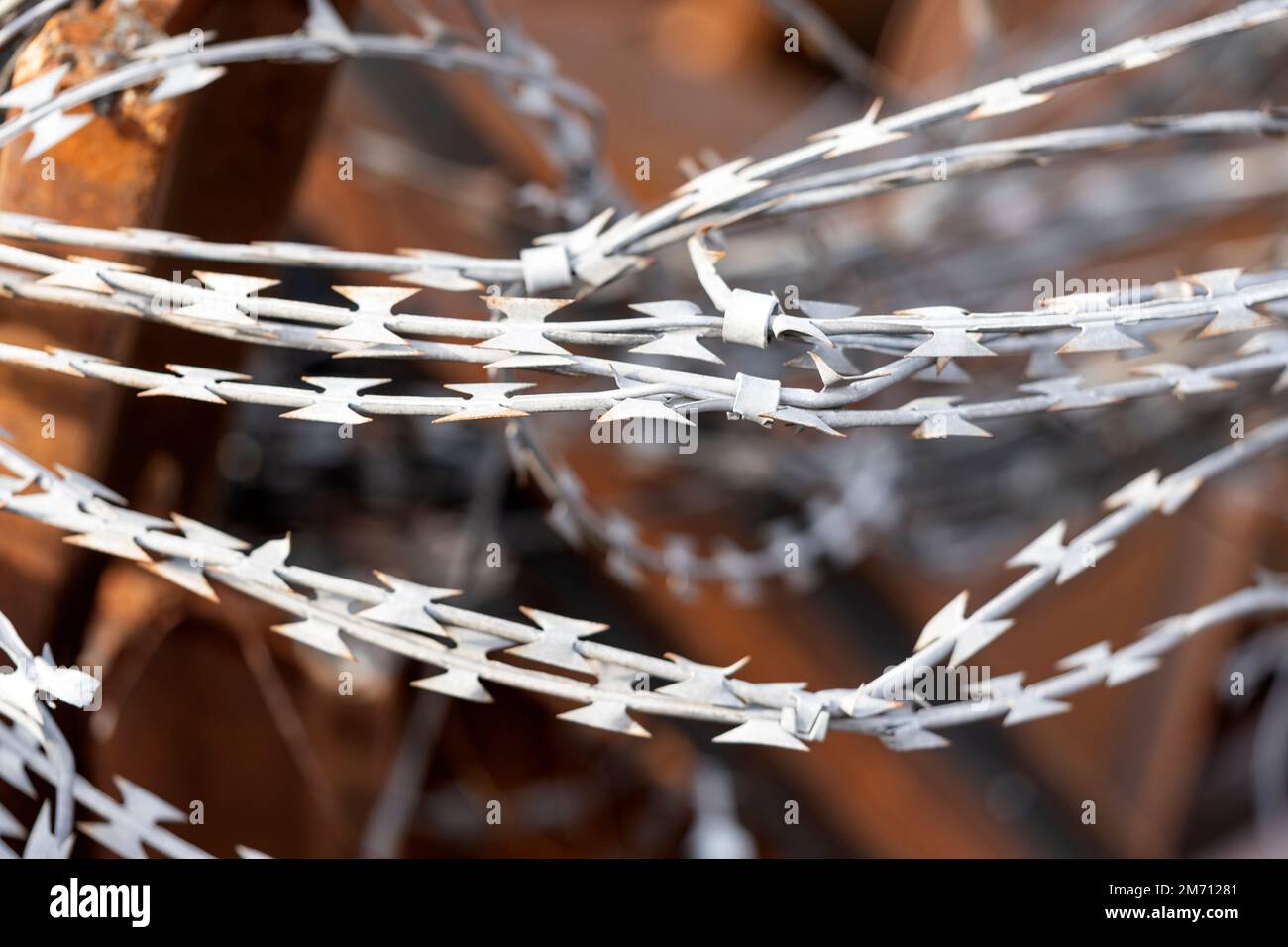 Barbed wire stretched over anti-tank hedgehogs. Fortified defense line ...