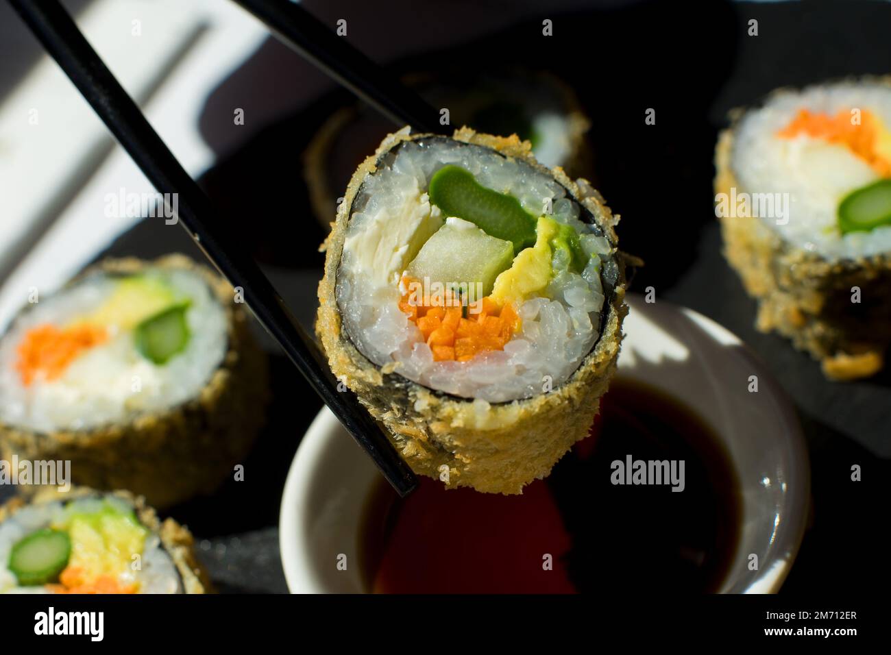 Vegetarian hot roll. Sushi roll stuffed with vegetables and fried whole ...
