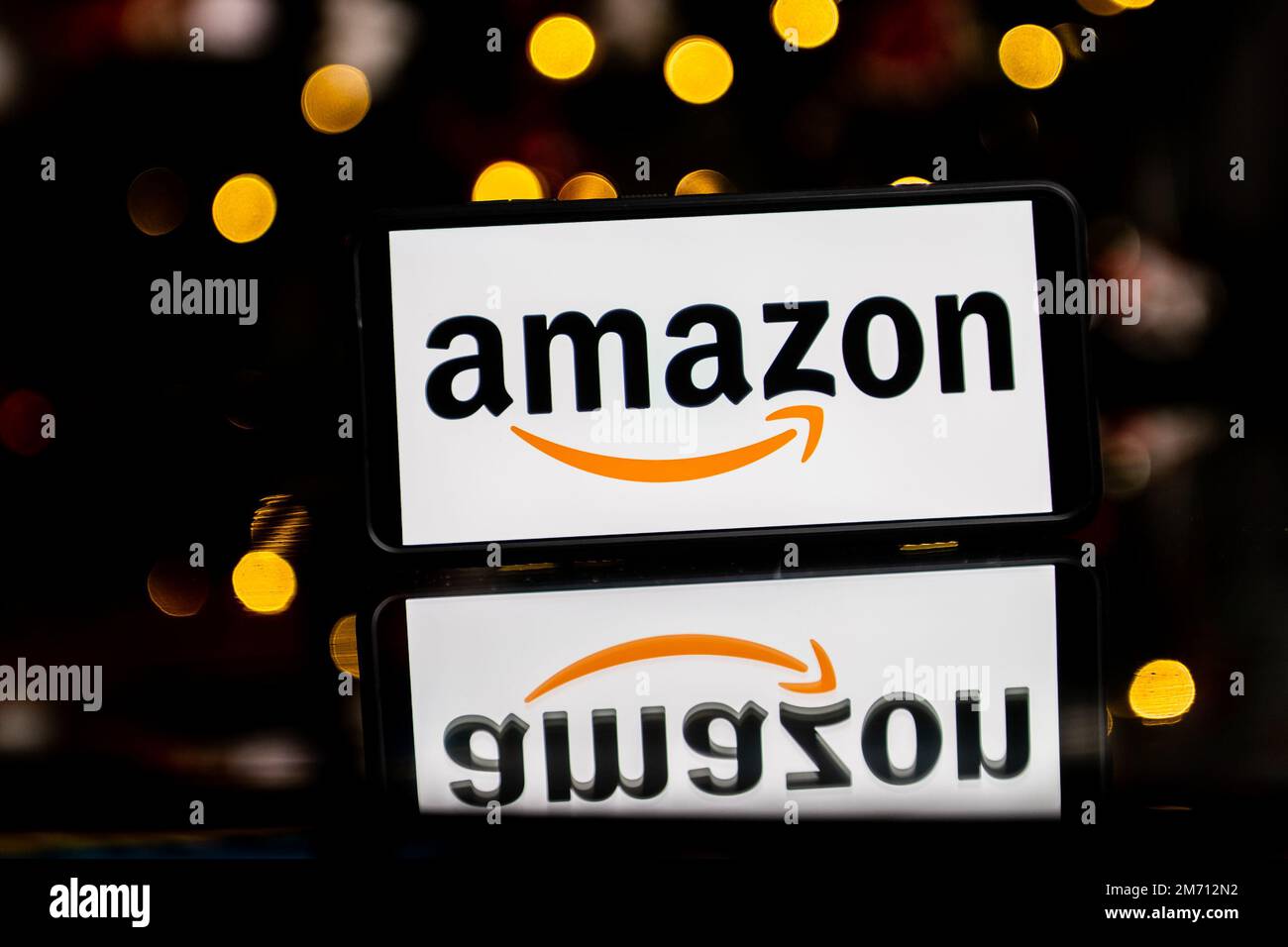 In this photo illustration an Amazon logo seen displayed on a ...