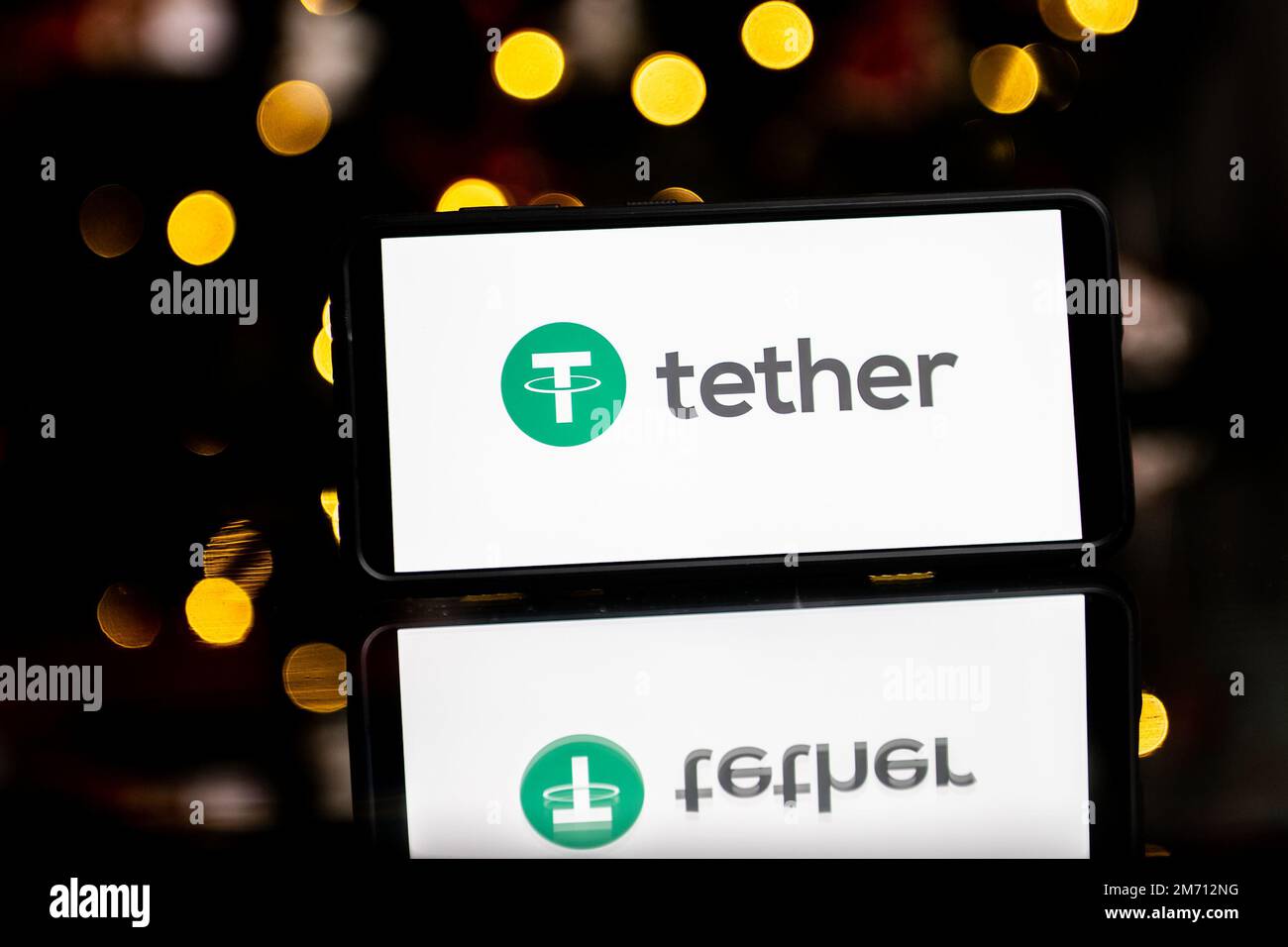 In this photo illustration a Tether logo seen displayed on a smartphone ...