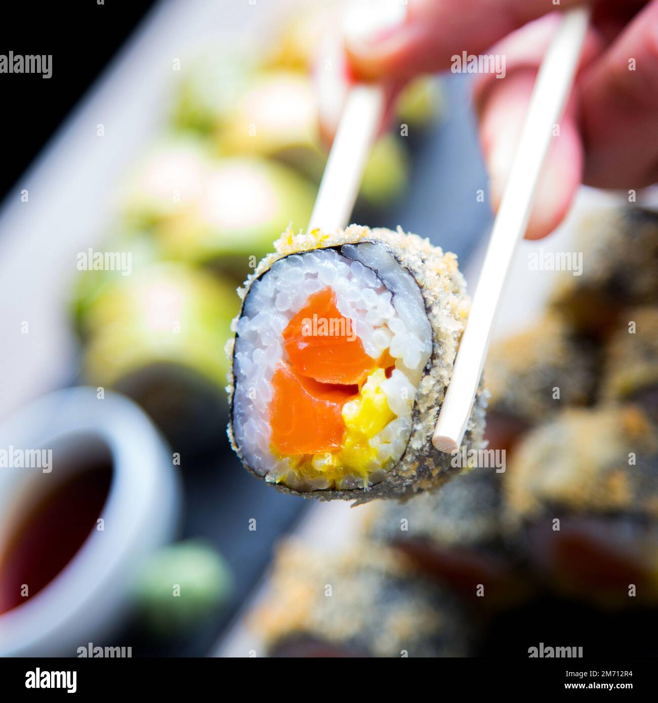 Salmon hot roll. Sushi roll stuffed with salmon and fried whole with ...