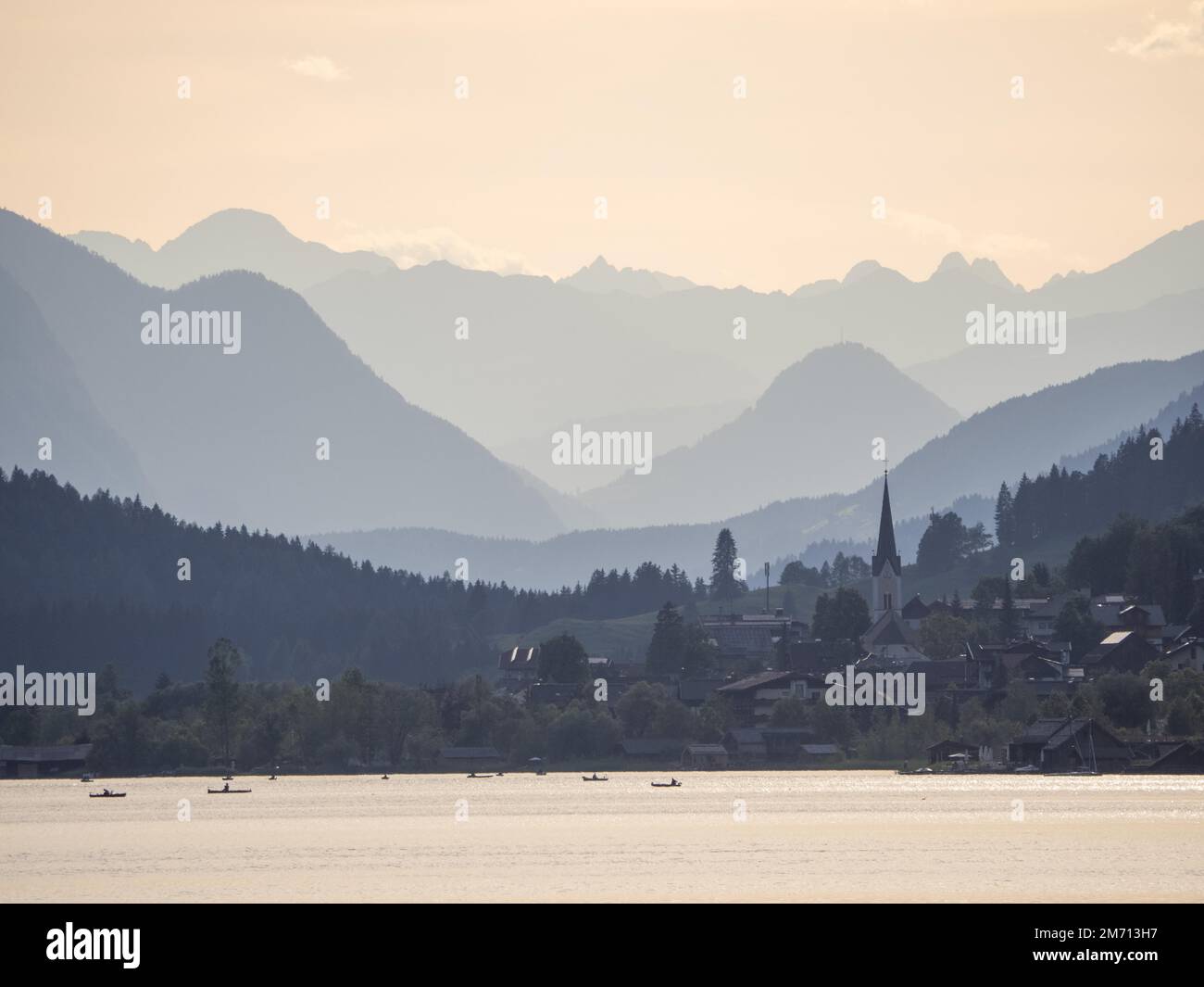 Evening atmosphere at Lake Weissensee, highest bathing lake in the Alps ...