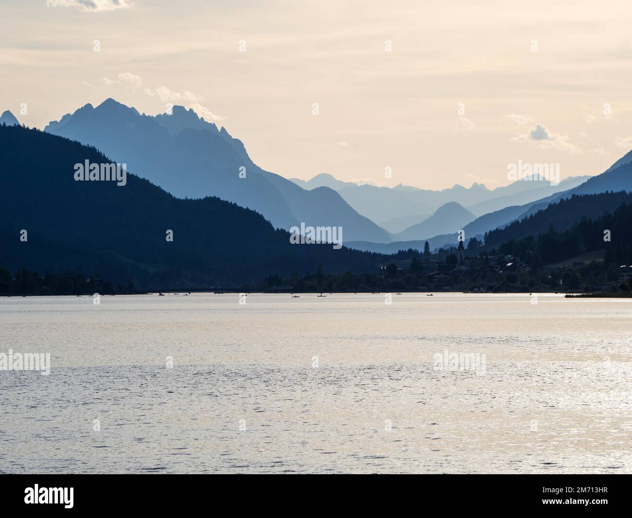 Evening atmosphere at Lake Weissensee, highest bathing lake in the Alps ...