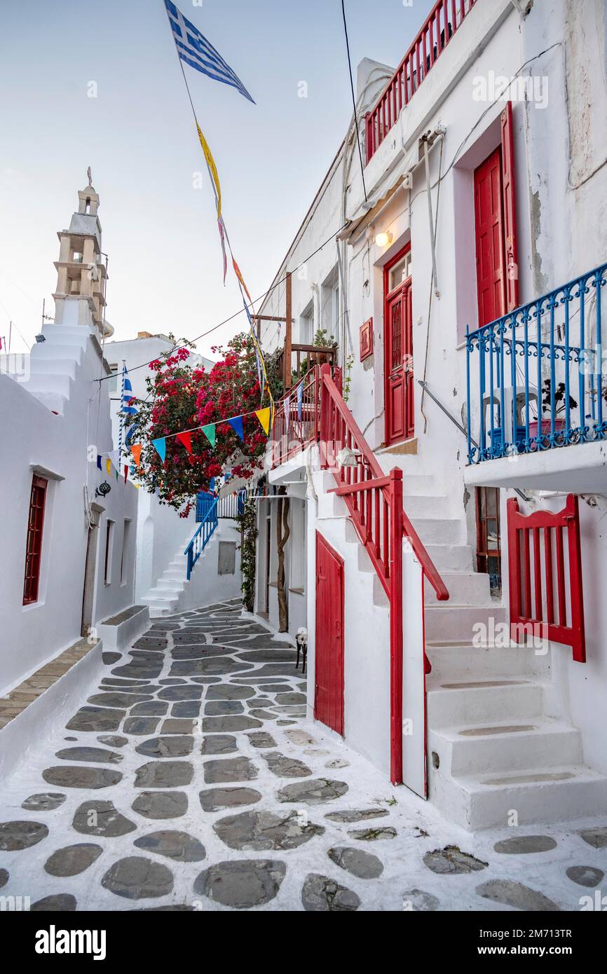 Cycladic white houses with red shutters and bougainvillea, Greek ...