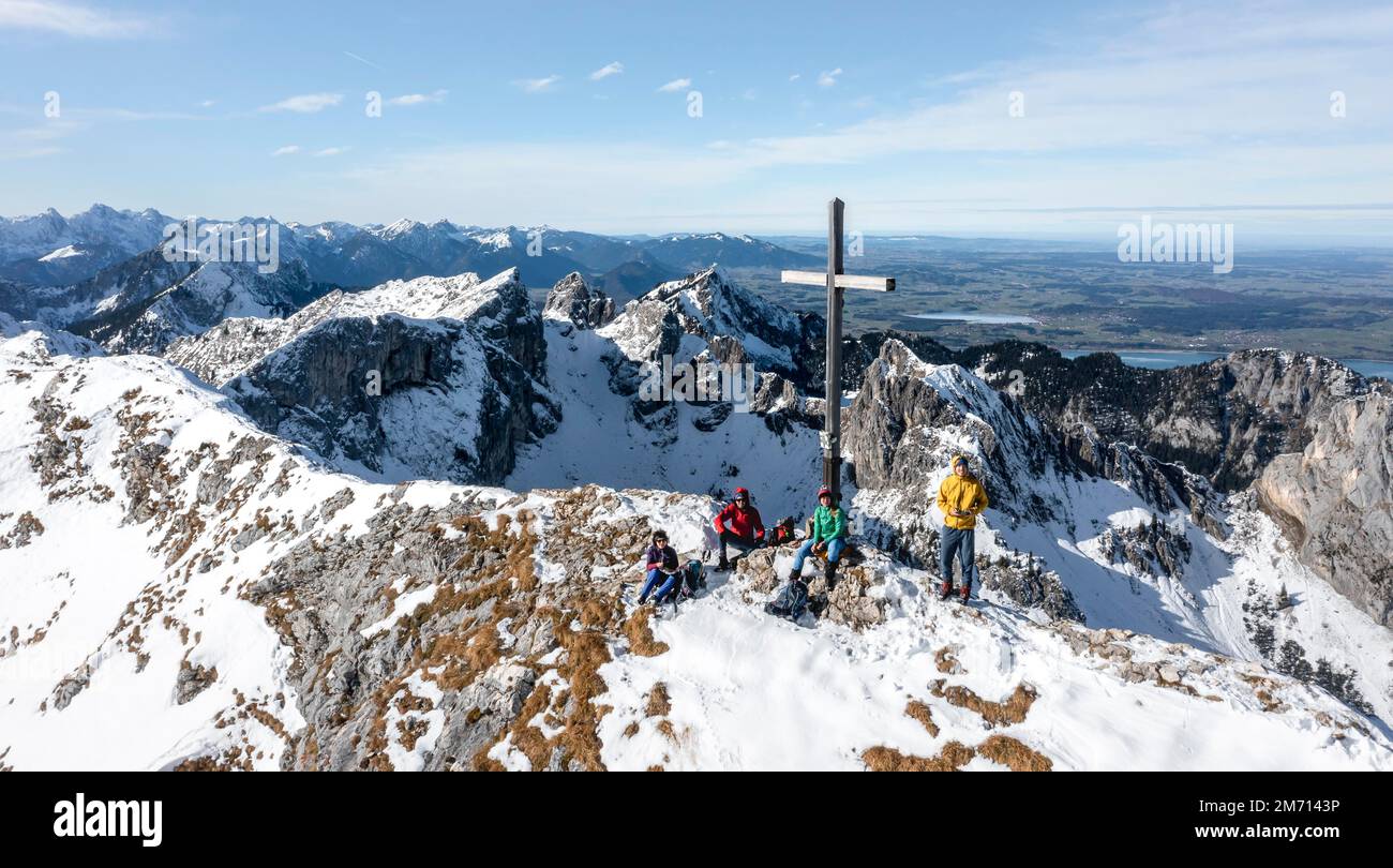 Mountaineers at the summit, Alpine panorama, Aerial view, Snow-covered ...