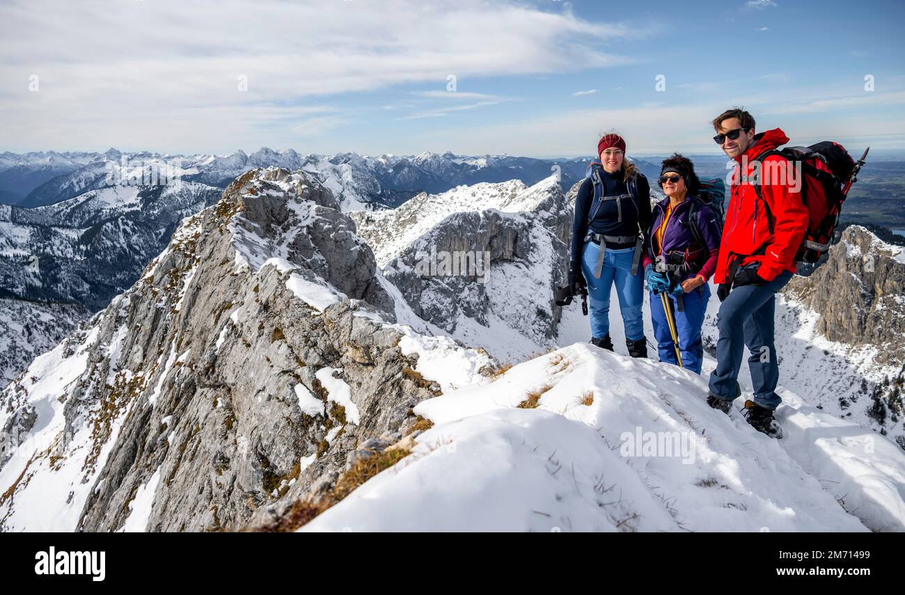 Climbers on the summit ridge, hiking to the Ammergauer Hochplatte in ...