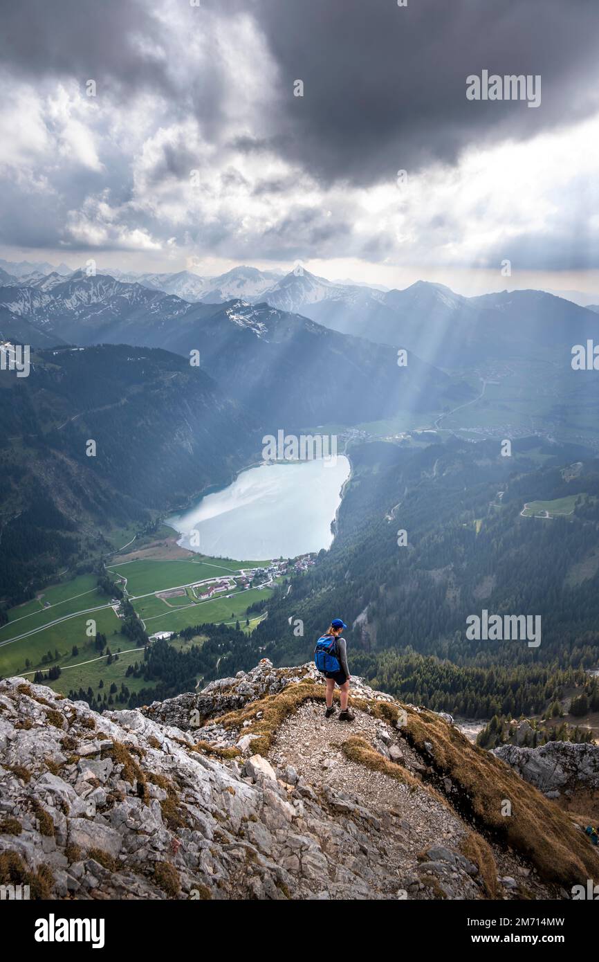 Evening atmosphere, mountain climber on hiking trail, looking at ...