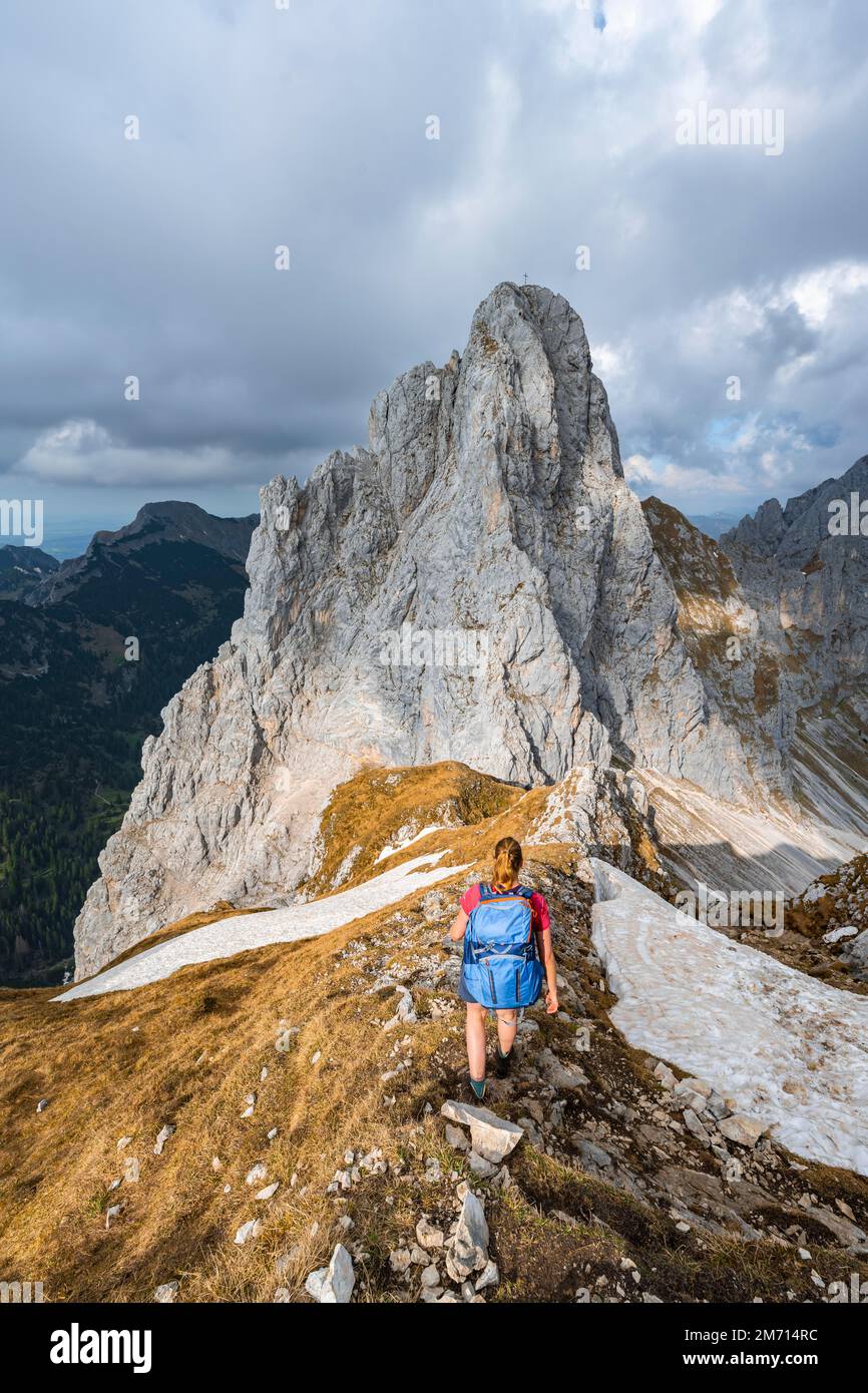 Evening atmosphere, mountaineer at the summit of the Rote Flueh looking ...
