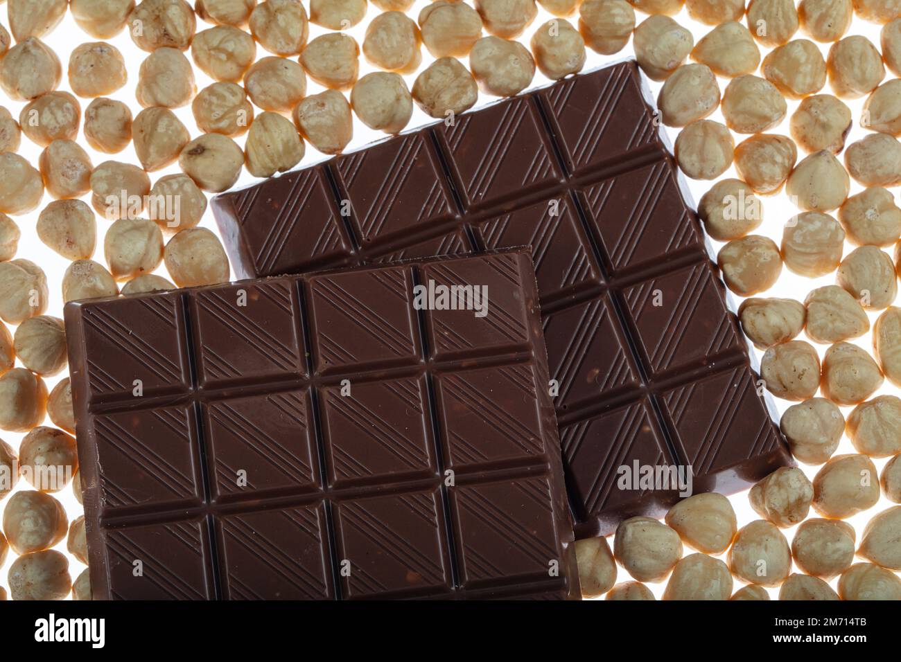 Hazelnut chocolate. Hazelnut chocolate bar pieces tower. Bars of milk ...