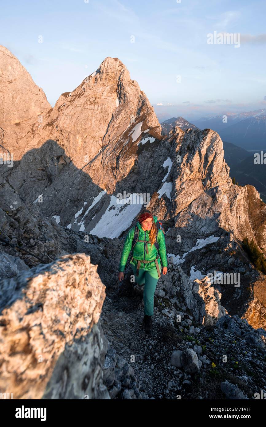 Evening mood, mountaineer at the summit of Schartschrofen, behind Rote ...