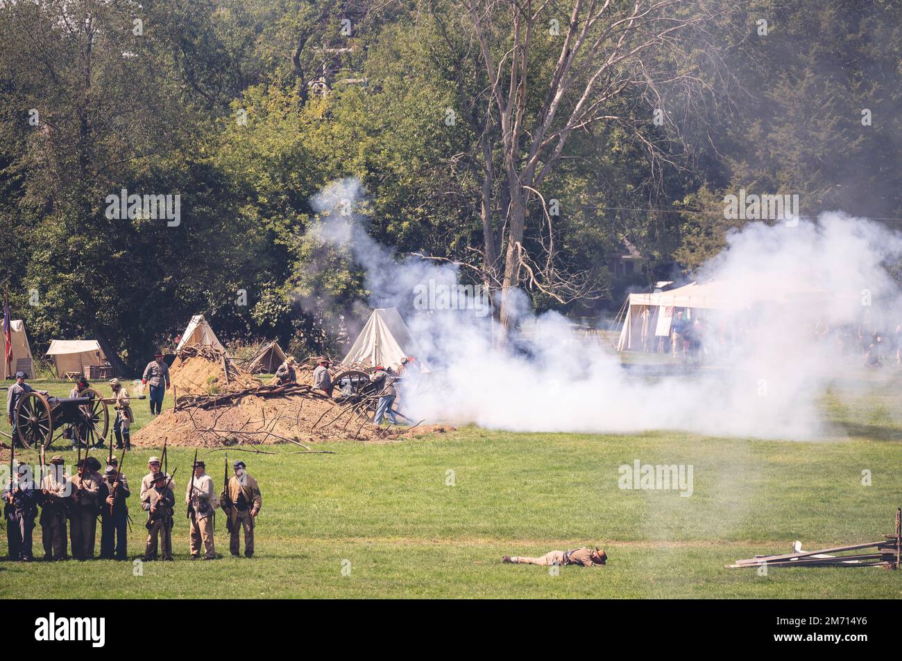 A big smoke and soldiers around, in a military camp in the Civil War ...