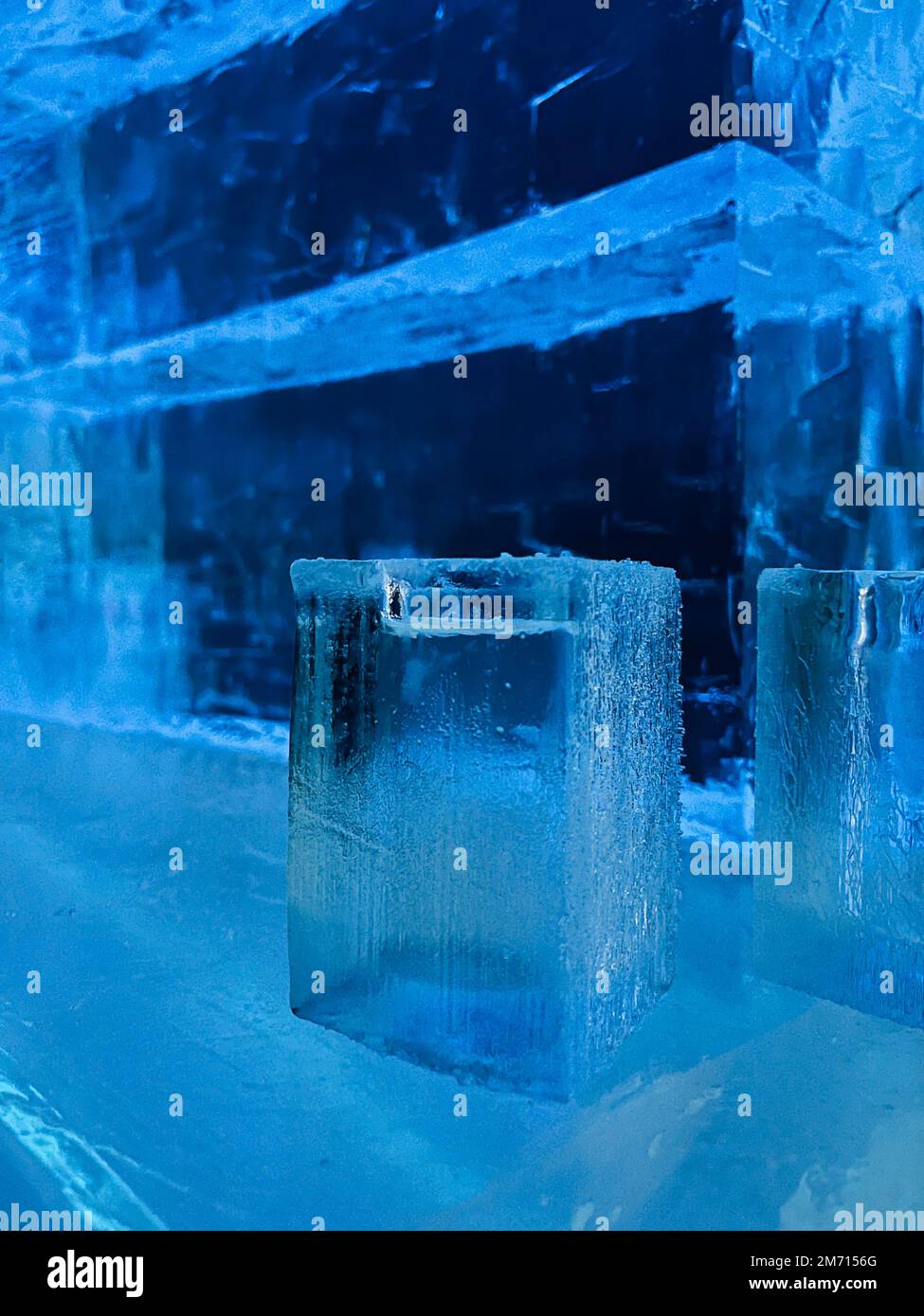 Close up of drink in glass made of ice in ice bar in Stockholm Sweden ...