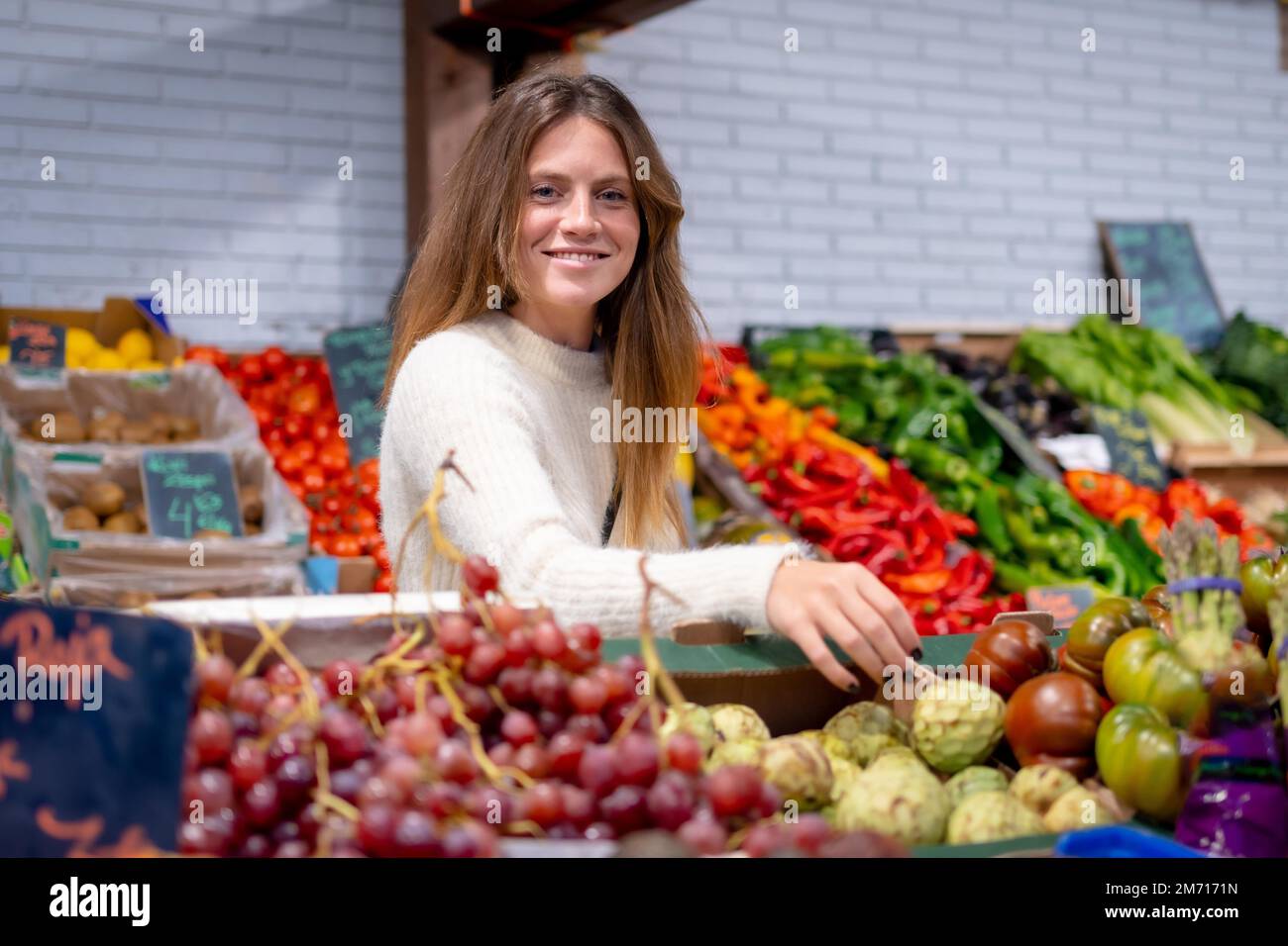 Woman worker of a greengrocer and vegetable food store. healthy and ...