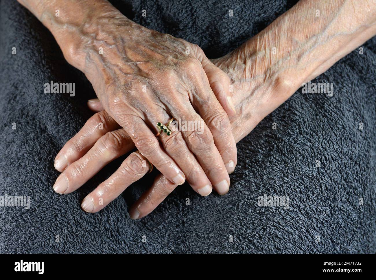Aging process - very old senior woman hands isolated on black ...