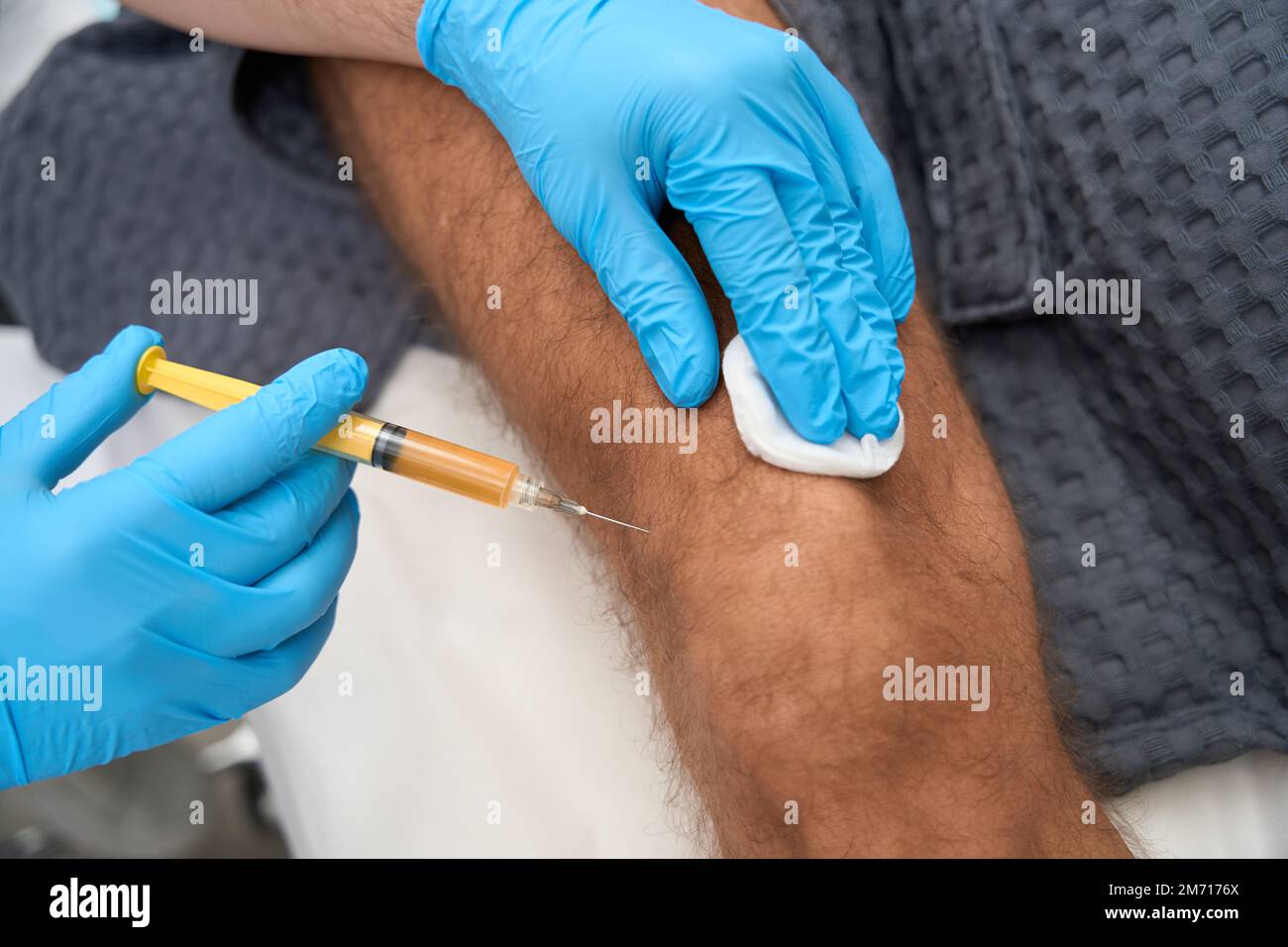 Professional doctor taking biopsy sample from knee of the patient Stock ...