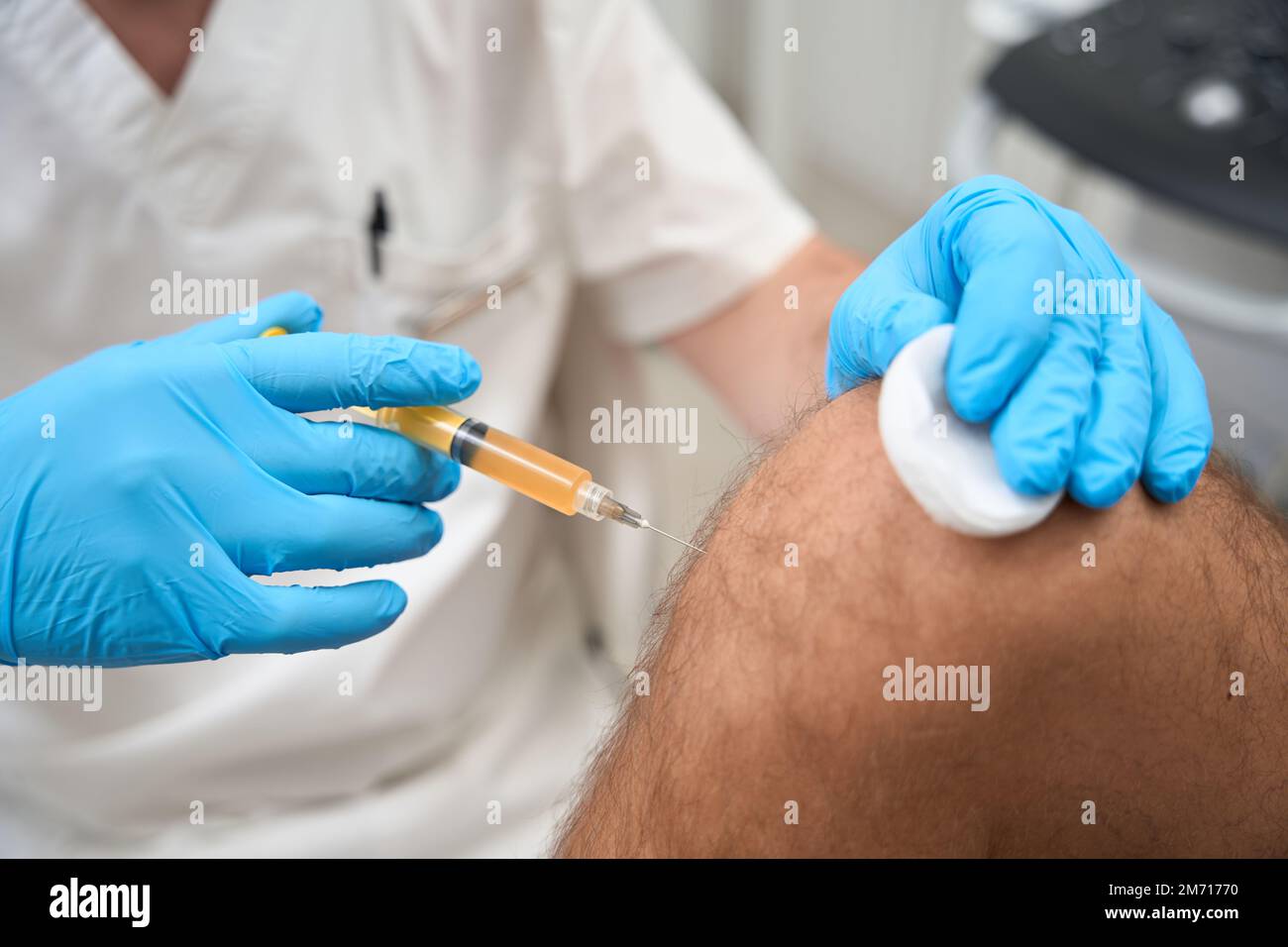 Certified healthcare professional taking a biopsy sample from knee ...