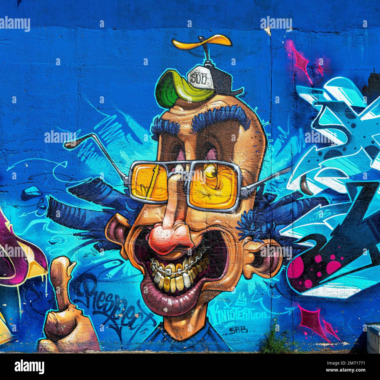 Colourful graffiti on the wall of the woman's prison in Berlin Moabit ...