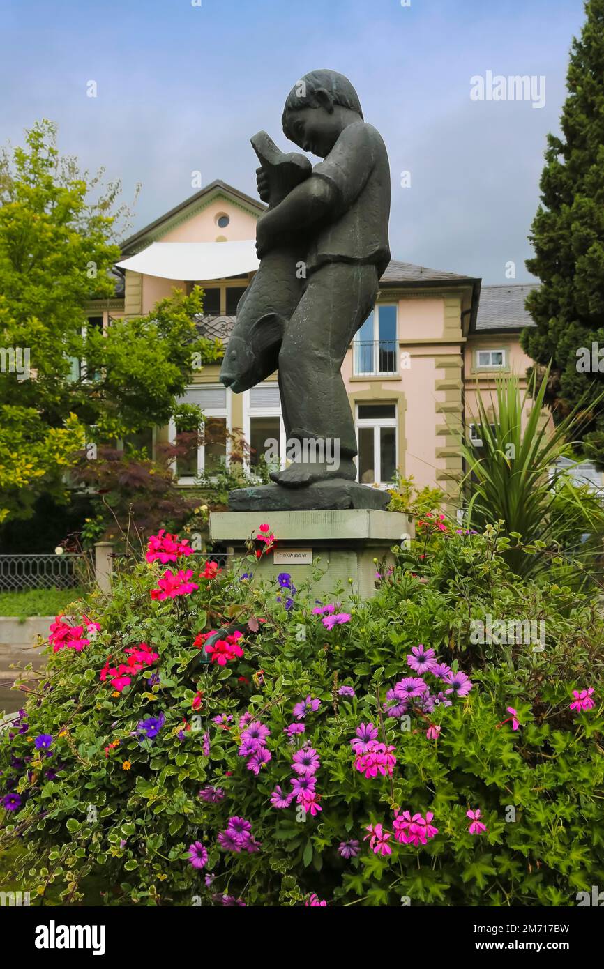 Drinking water fountain, boy with fish, stone figure, sculpture ...