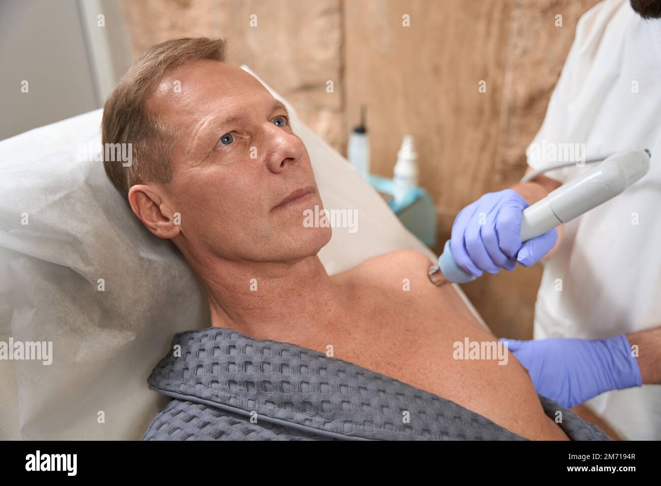 Serene patient of progressive medical clinic undergoing non-invasive ...