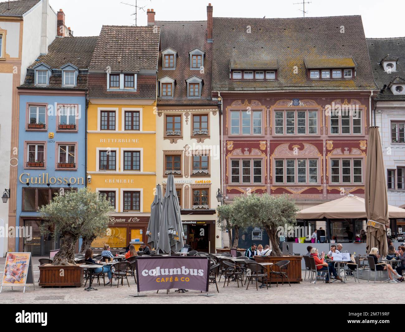 Medieval building with tables in the restaurant around the Place de la ...