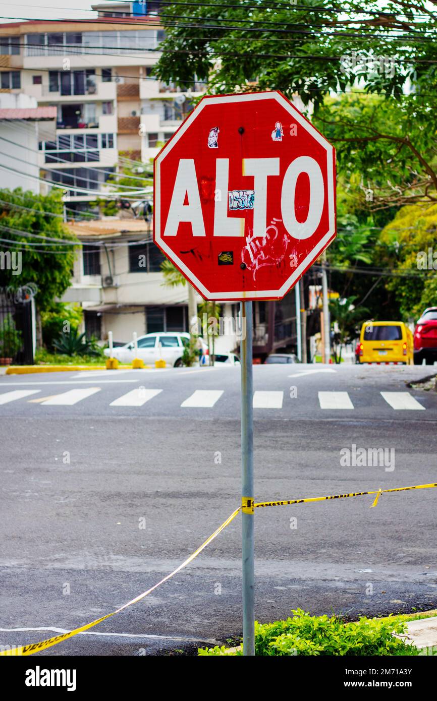stop sign on the corner of an intersection Stock Photo - Alamy