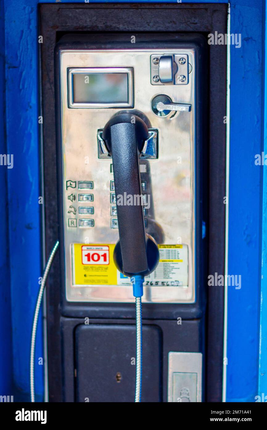 public telephone with blue coverage Stock Photo - Alamy