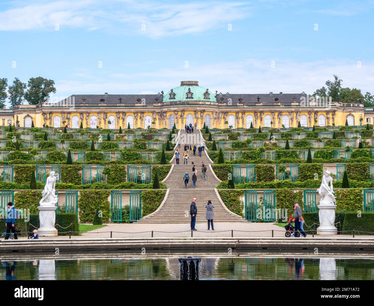 The water reflection of the Great Fountain and behind it Sanssouci ...