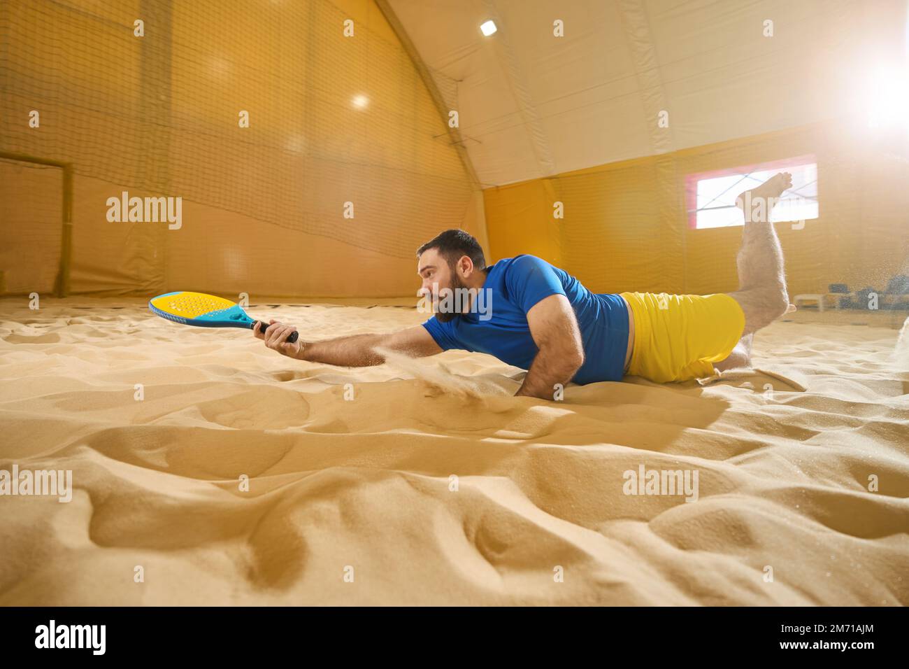 Man touches sand with belly on court for playing frescoball Stock Photo ...