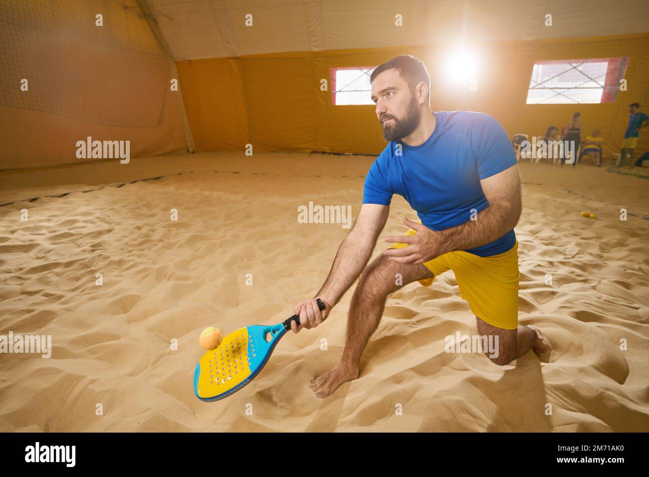Man bouncing tennis ball with a racket while playing frescoball Stock ...