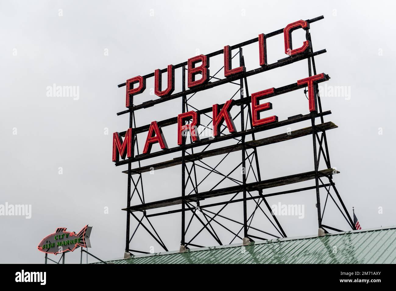 A red sign of public market against a gray sky Stock Photo - Alamy