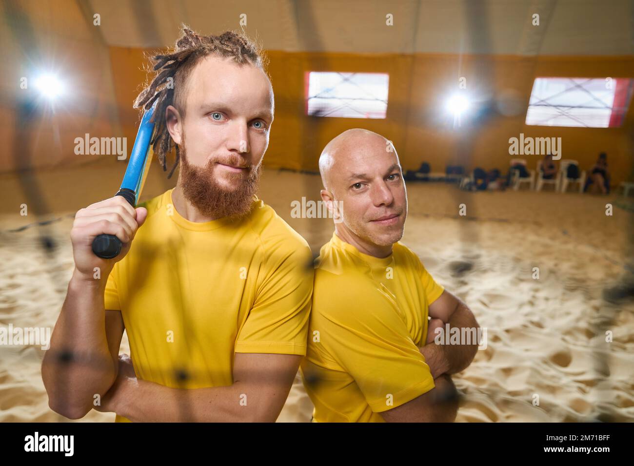 Two men stand half-turned to each other during sports game Stock Photo ...