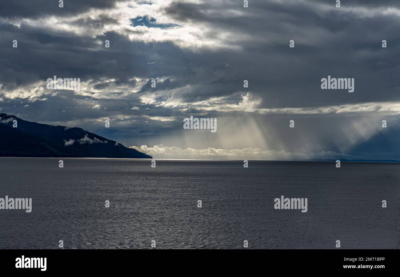 A beautiful shot of the sun shining on water near the Kenai Peninsula ...