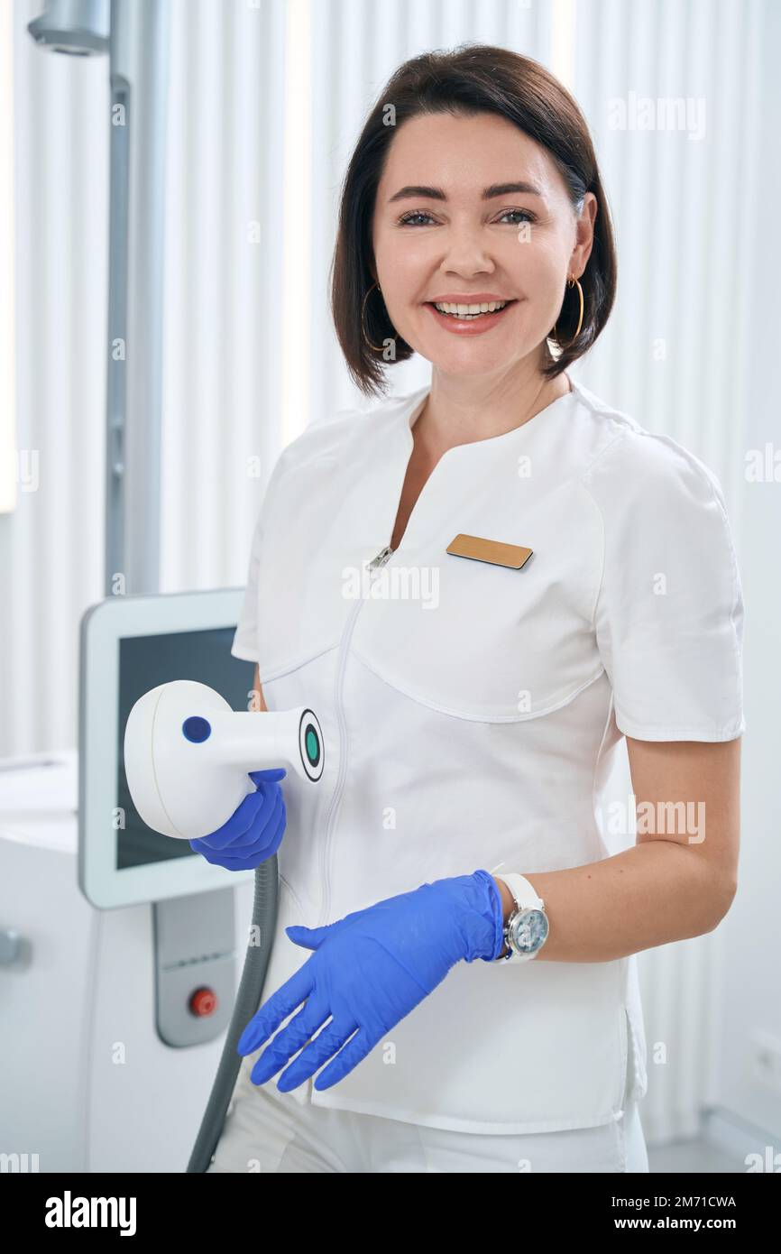 Doctor holds applicator of BTL 600 shock wave therapy device Stock ...