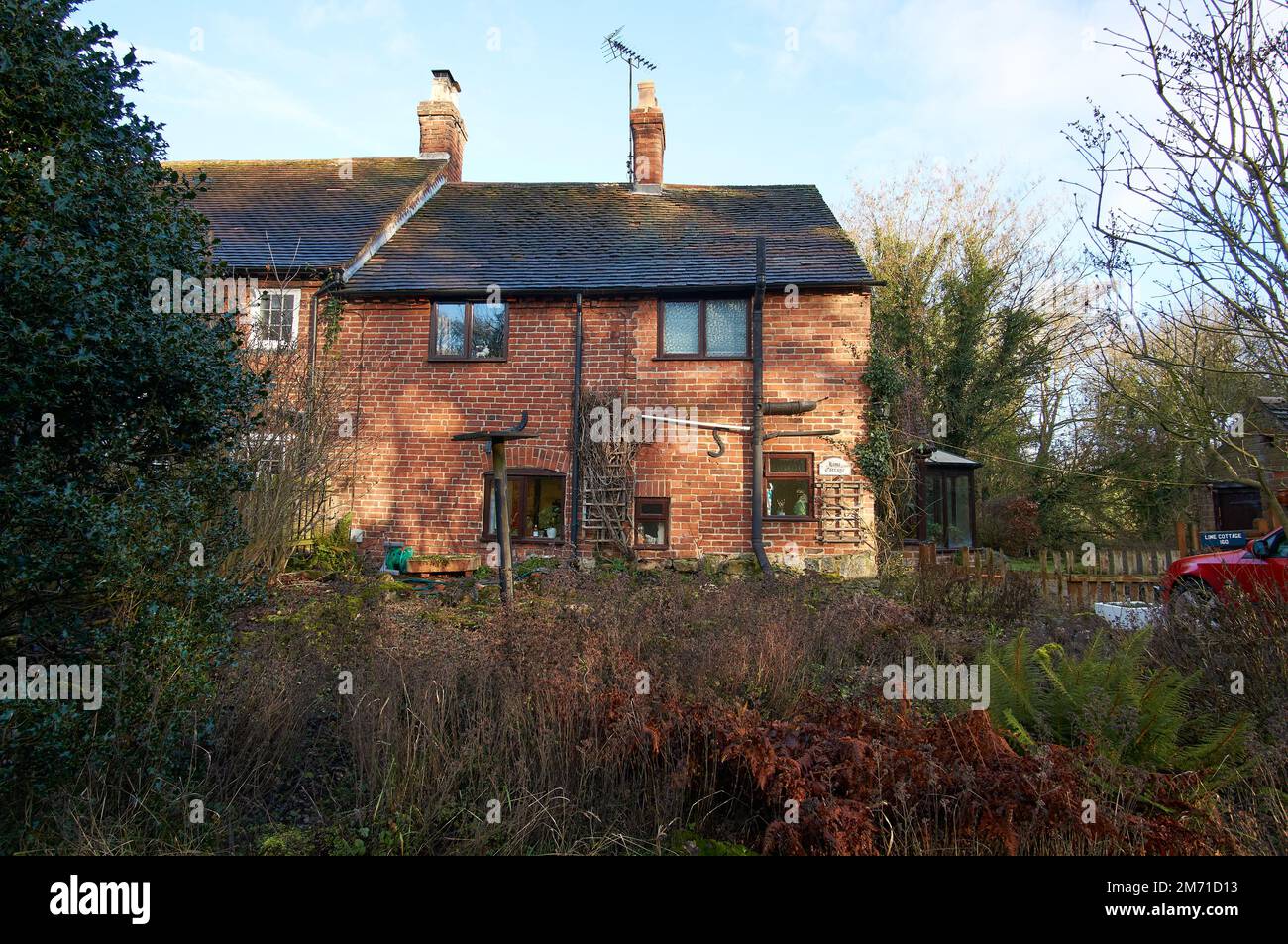 Overgrown country home back garden example Stock Photo - Alamy