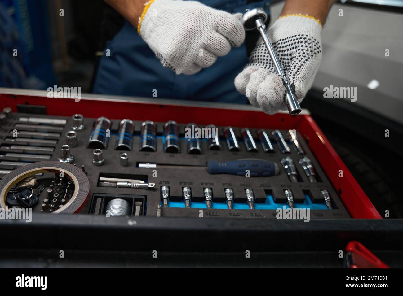Close up photo of man holding car instruments Stock Photo - Alamy