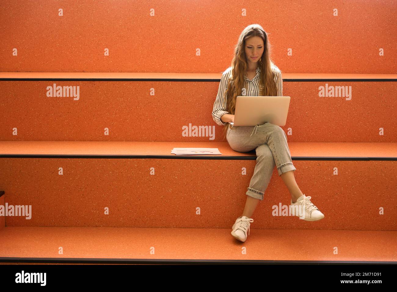 Smiling student typing report hi-res stock photography and images - Alamy
