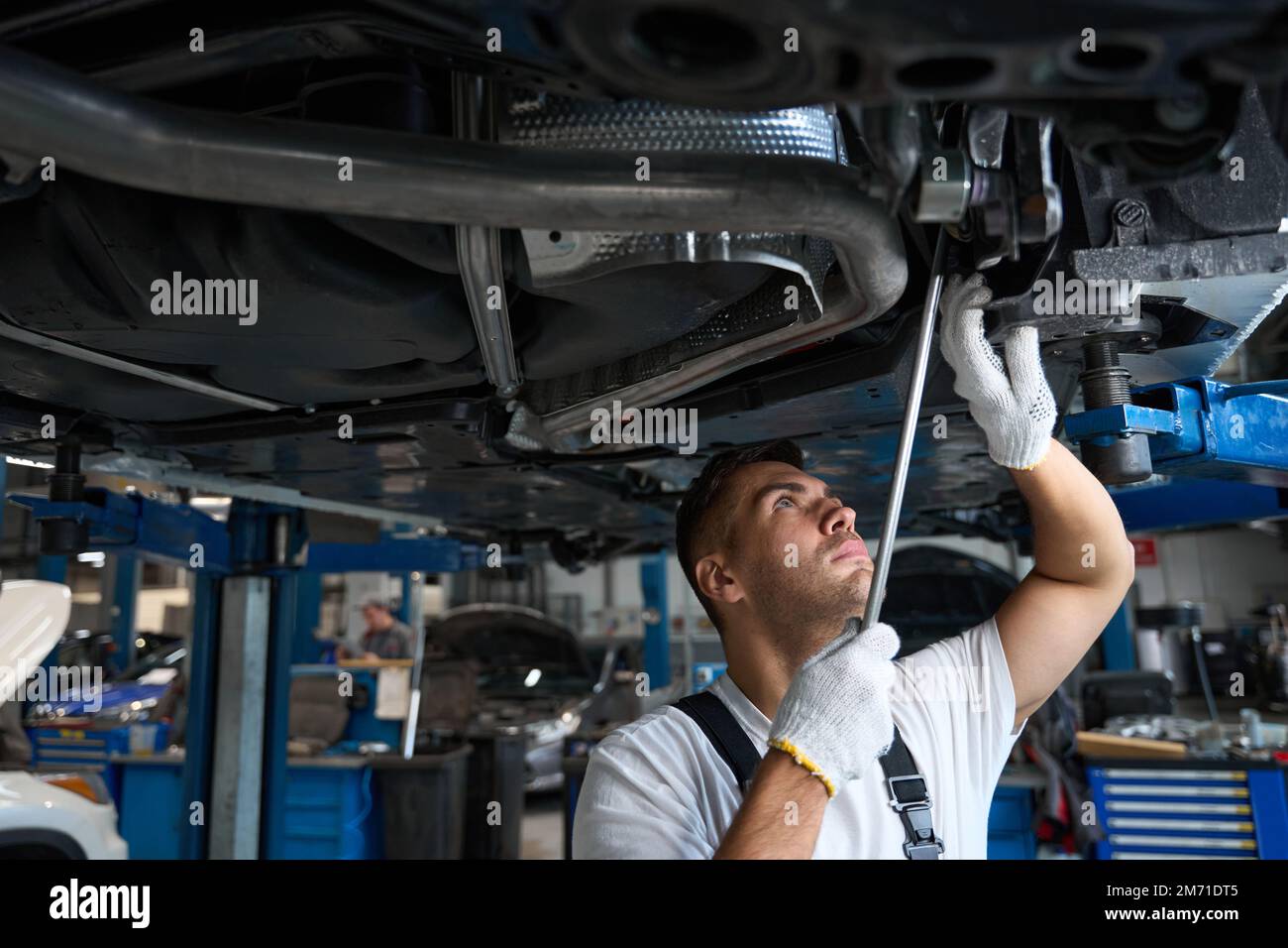 Worker replacing car parts hi-res stock photography and images - Alamy