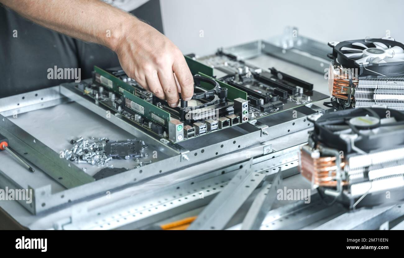 Man engineer,collector.Independent self computer assembly. Mounting socket processor,random ...