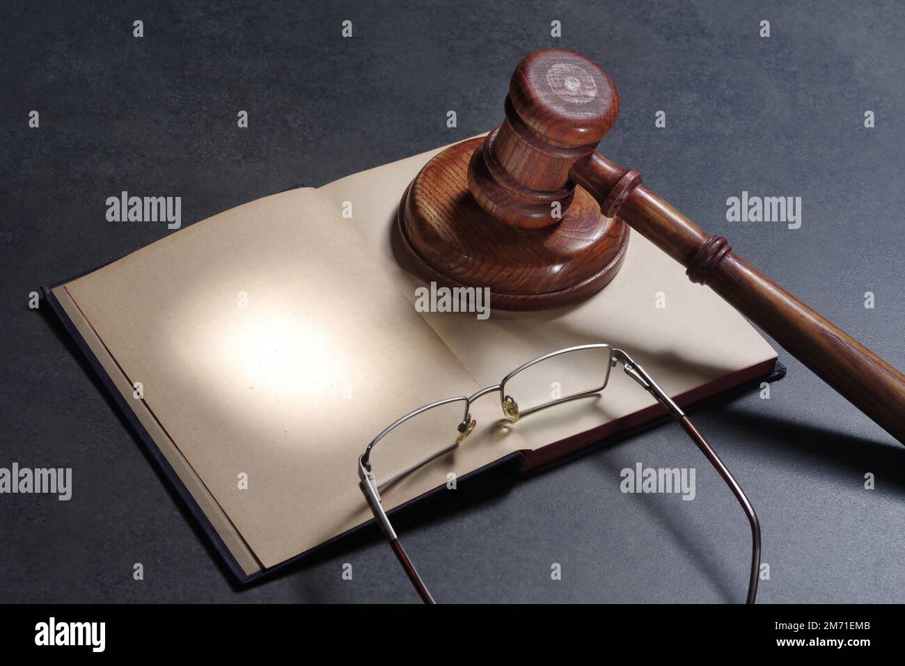 Legal concept of law and justice. Open notebook law book with wooden gavel of judges on ...