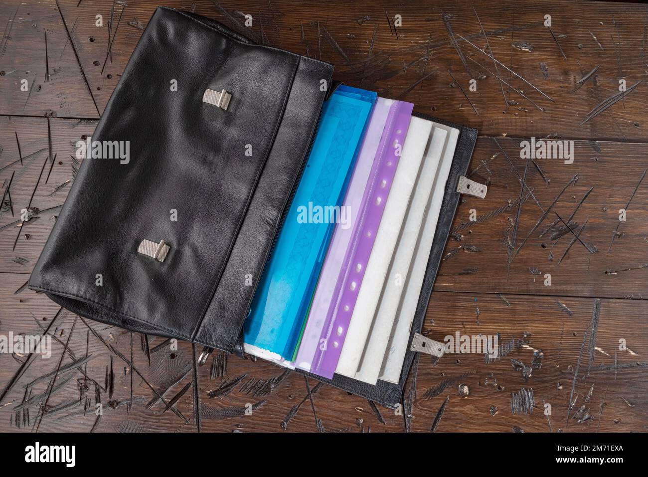 Leather briefcase with documents. Lots of documents in the portfolio ...