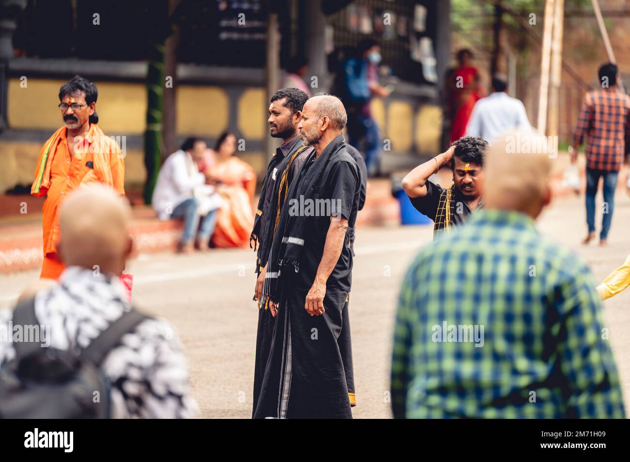 Hindu men standing at the Lakshmi Narasimha Swamy Temple in ...