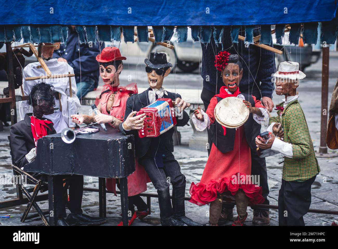 View of street puppet show theatre, with puppeteer puppet master ...