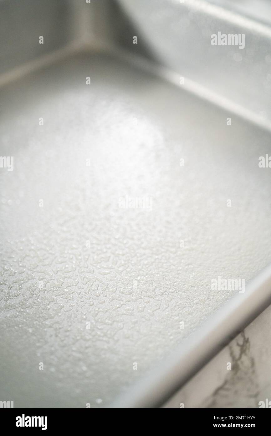 Greasing baking pan Stock Photo - Alamy