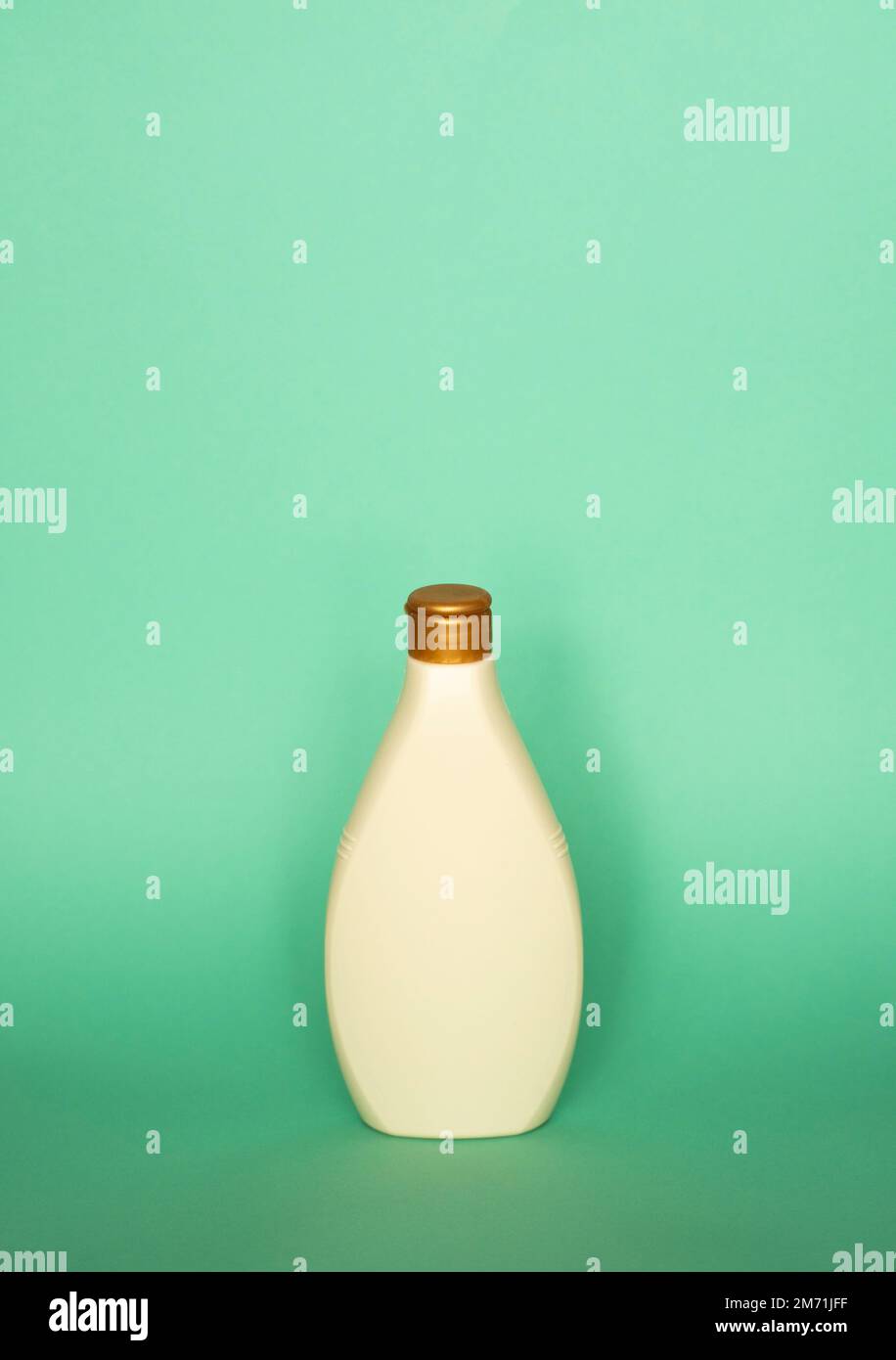 Blank beige shampoo bottle or shower gel on pastel green background ...