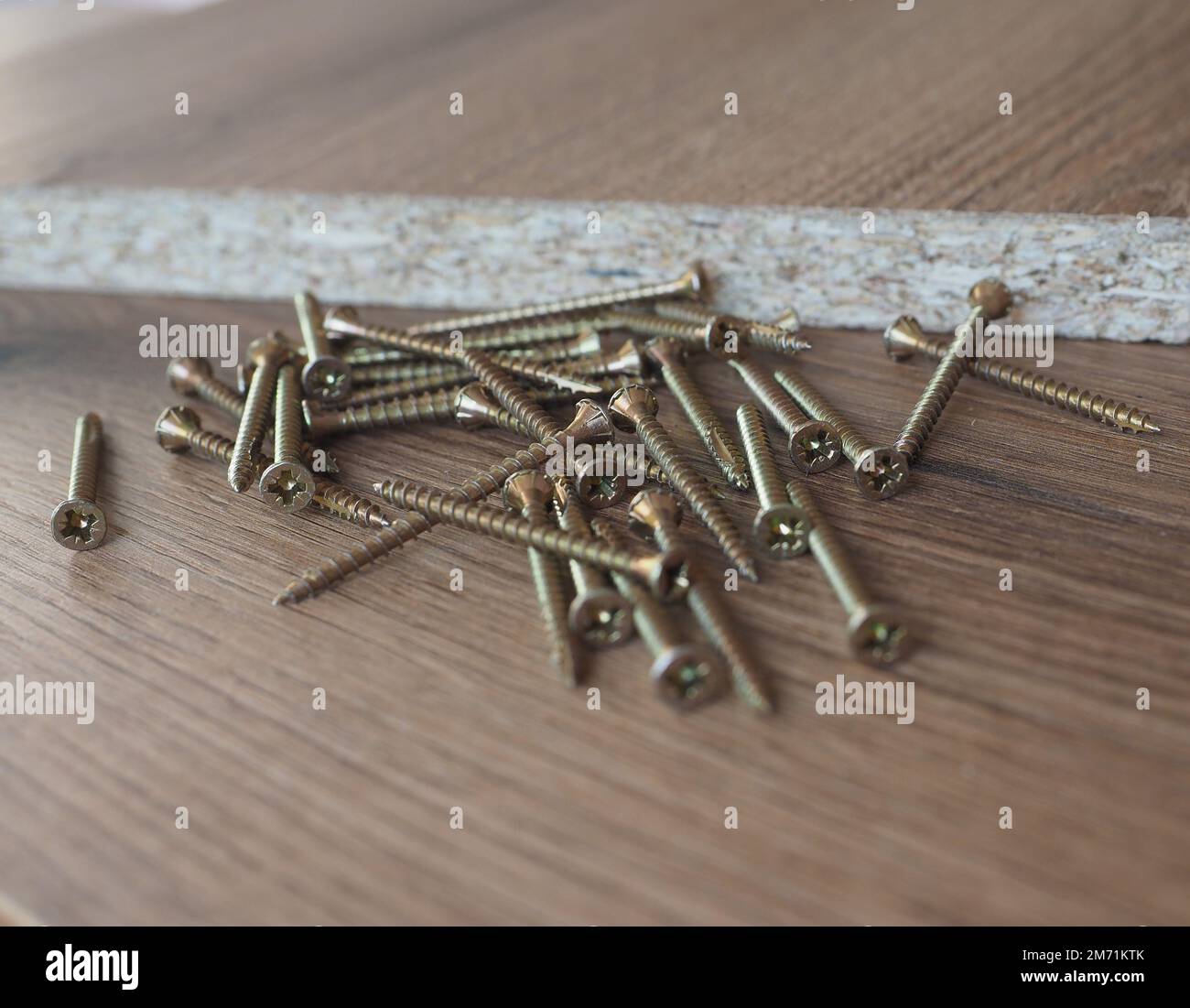 wood screws on melamine manufactured wood panel Stock Photo - Alamy