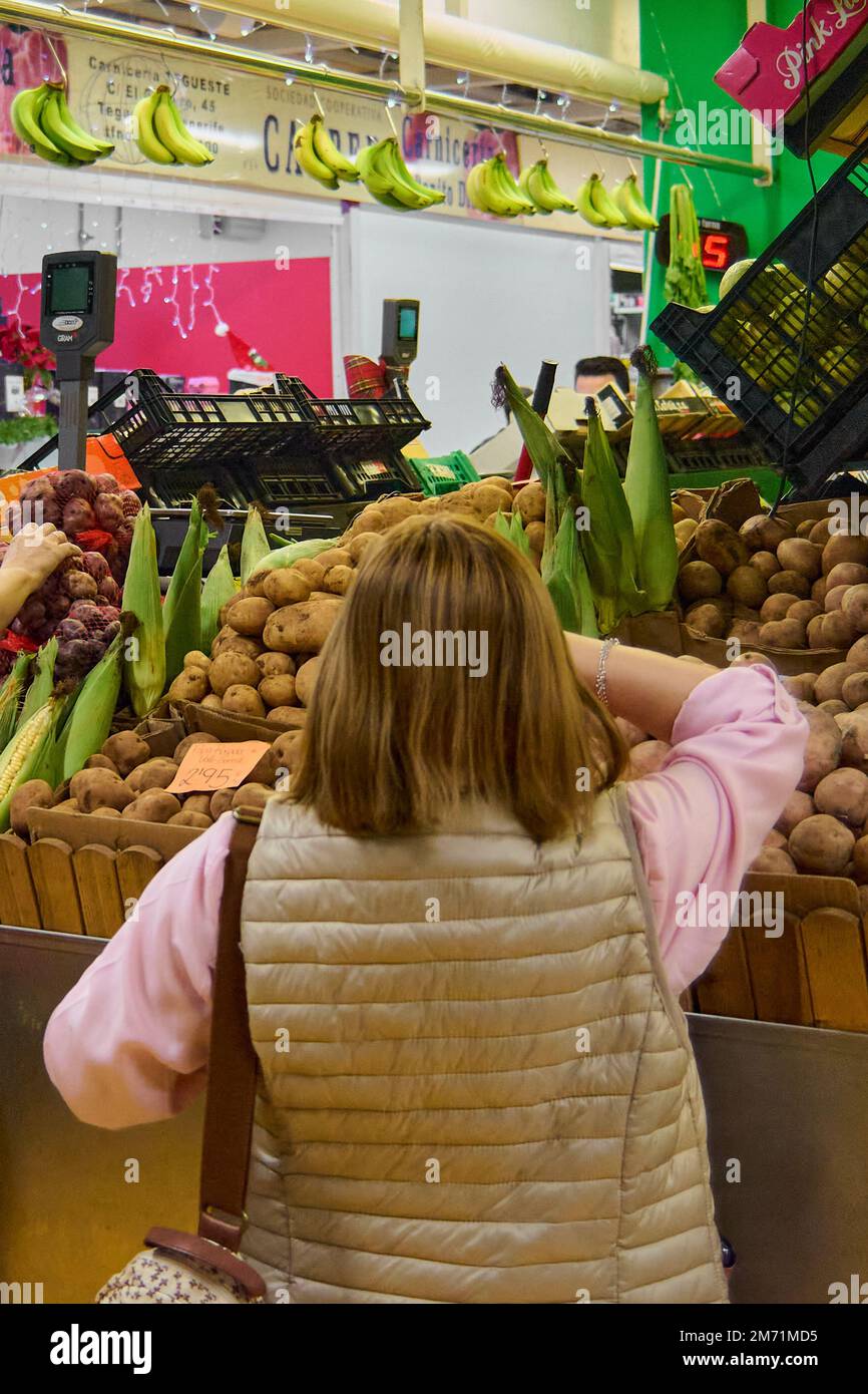 Tenerife, Spain - January 06, 2023: Woman doing her daily shopping in a ...