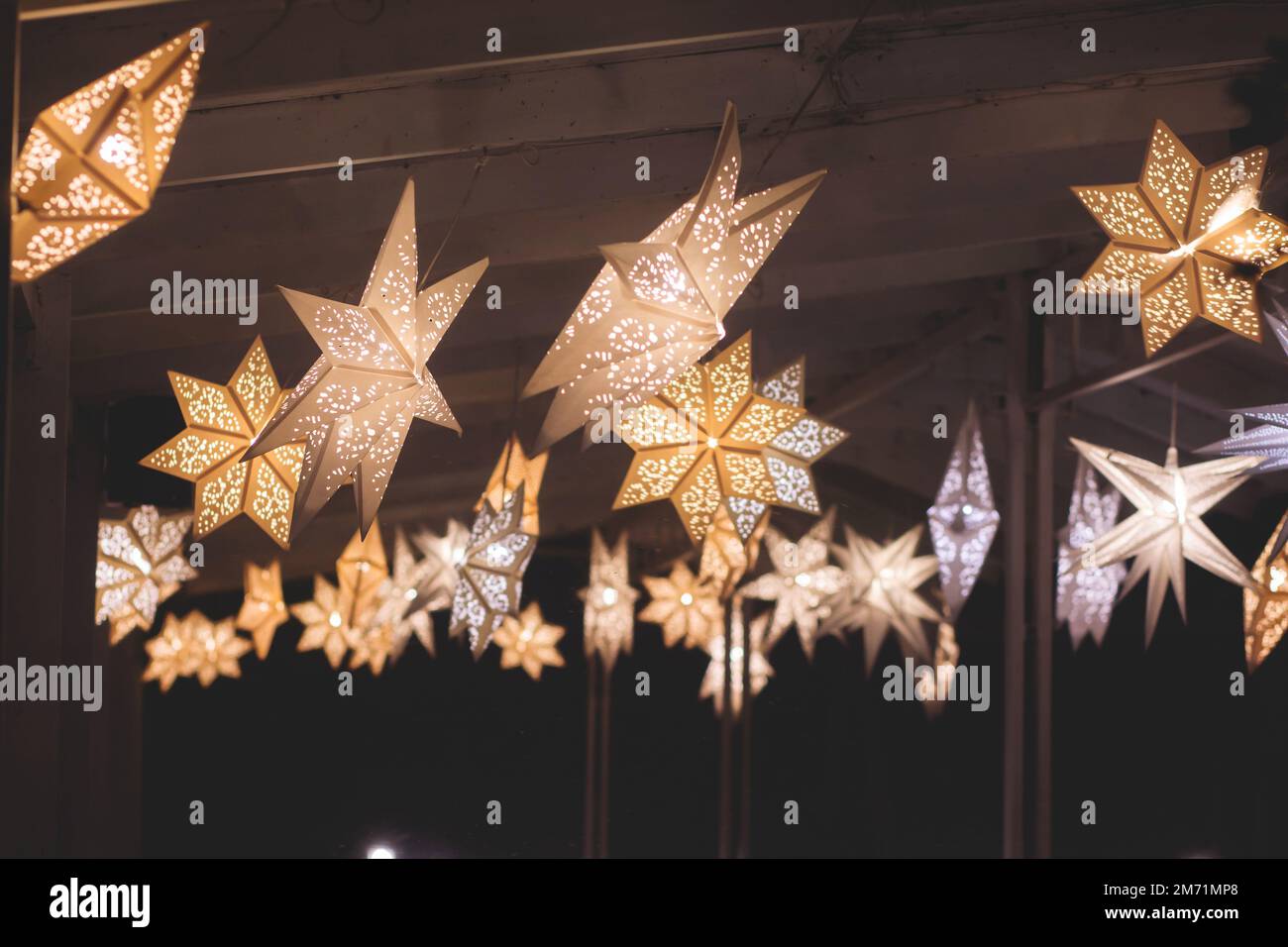 Glowing electric decorations in a winter snowy street, night decor ...